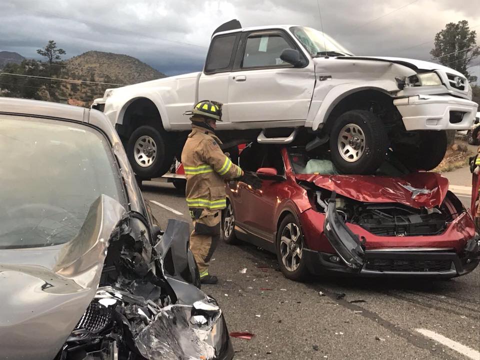 Pictures Show Sideswiped Truck After It Flipped, Landed on Another Car ...