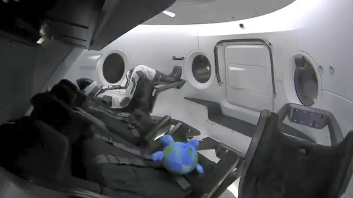 US-Built Capsule With a Dummy Aboard Docks at Space Station