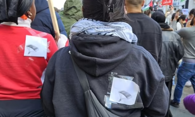 Police Arrest 2 Women Suspected of Wearing Hamas Paraglider Images at ...