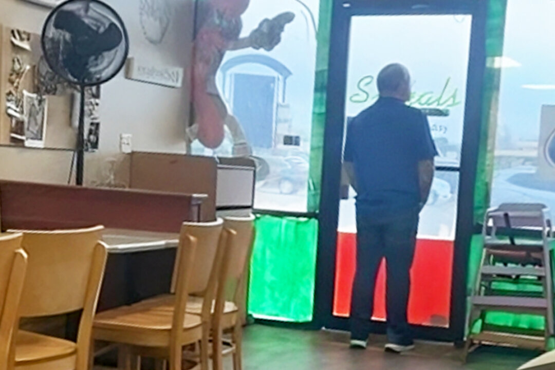 Army Guard Posts Photo of Restaurant Owner Looking Out the Door for ...