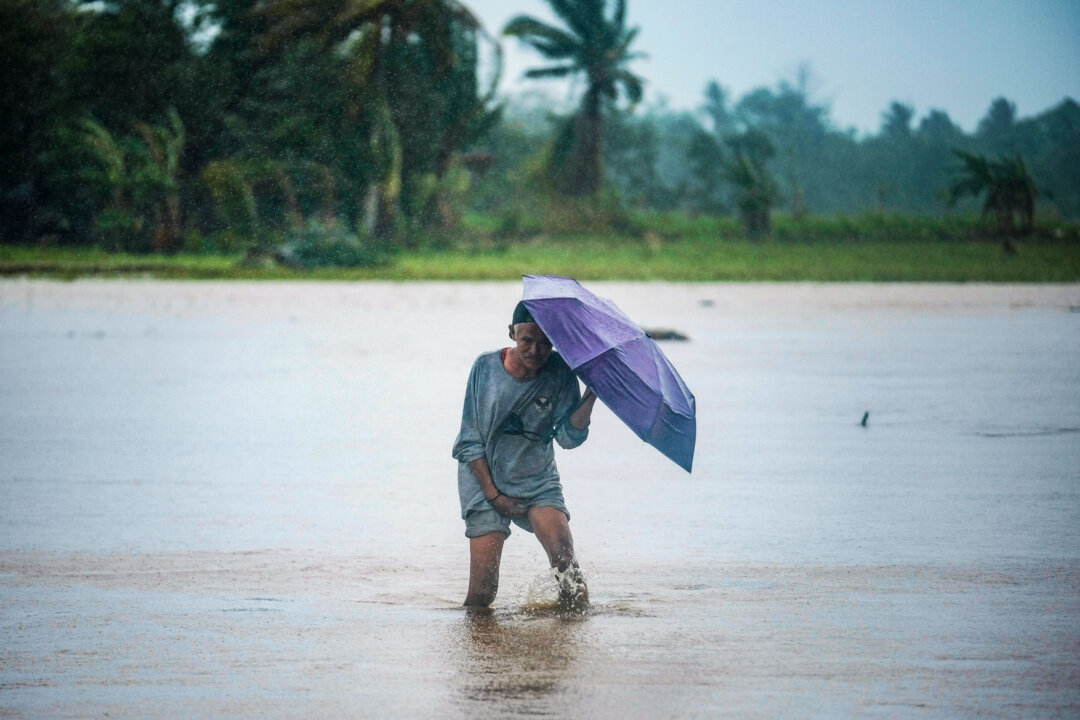 Tropical Storm Battering Philippines Leaves at Least 24 People Dead in ...