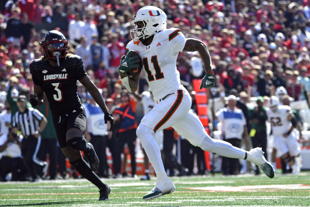 Cam Ward Throws for 4 Touchdowns, No. 6 Miami Survives Louisville ...