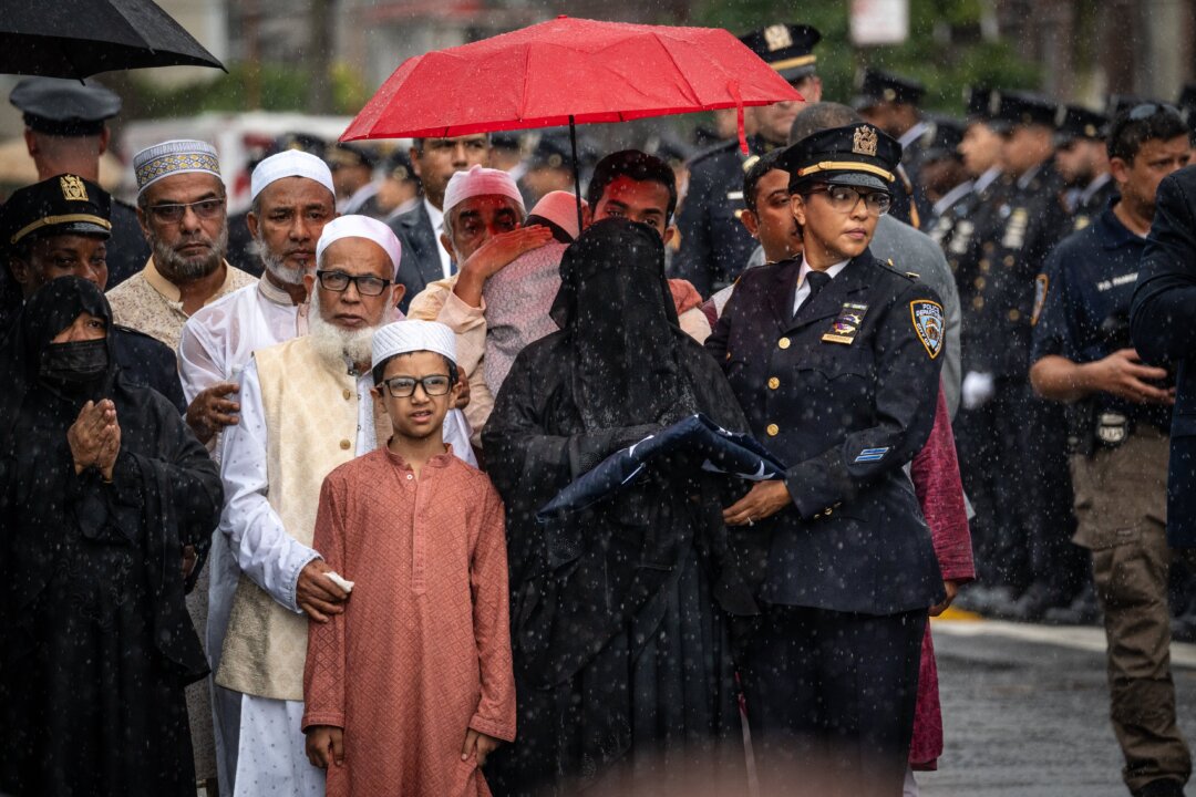 America in Photos: The Funeral of Didarul Islam, Tesla Diner Opening ...