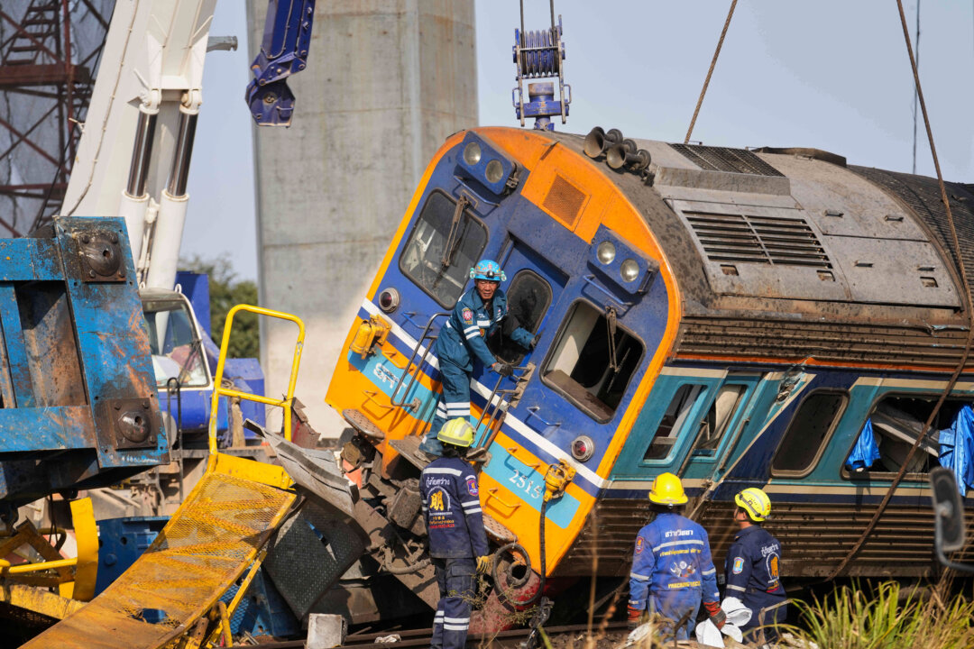 Day in Photos: Construction Crane Falls on Train, Transport Strike in ...